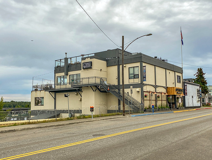 The industrial-chic exterior of 49th State Brewing Co. stands proudly against Alaska's moody skies, beckoning hungry travelers inside.