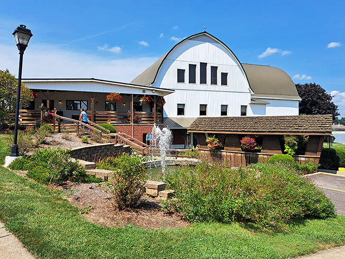 The iconic silhouette of The Barn Restaurant stands proudly against the Ohio sky, complete with authentic silo and curved roof that screams "comfort food ahead!"