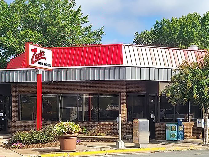 The iconic red and white exterior of Zack's Hot Dogs stands like a beacon of comfort food hope in Burlington's landscape.