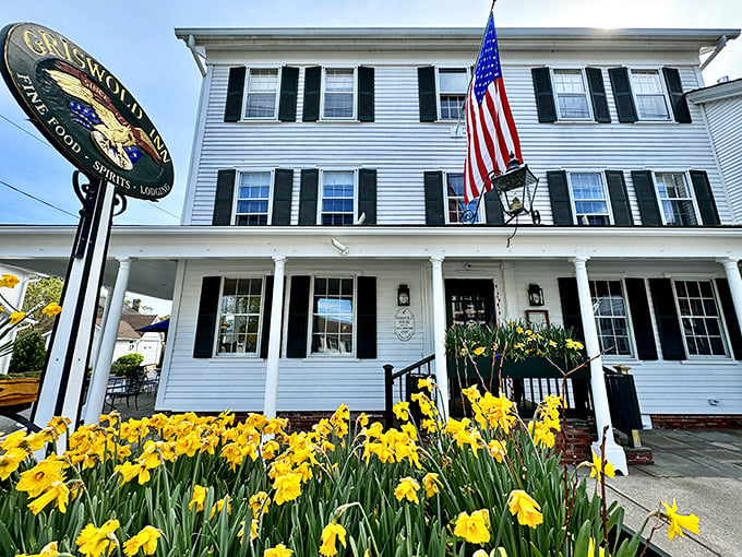 Spring brings a burst of yellow daffodils to frame this historic white clapboard building, where the American flag waves as proudly as the day it was designed.