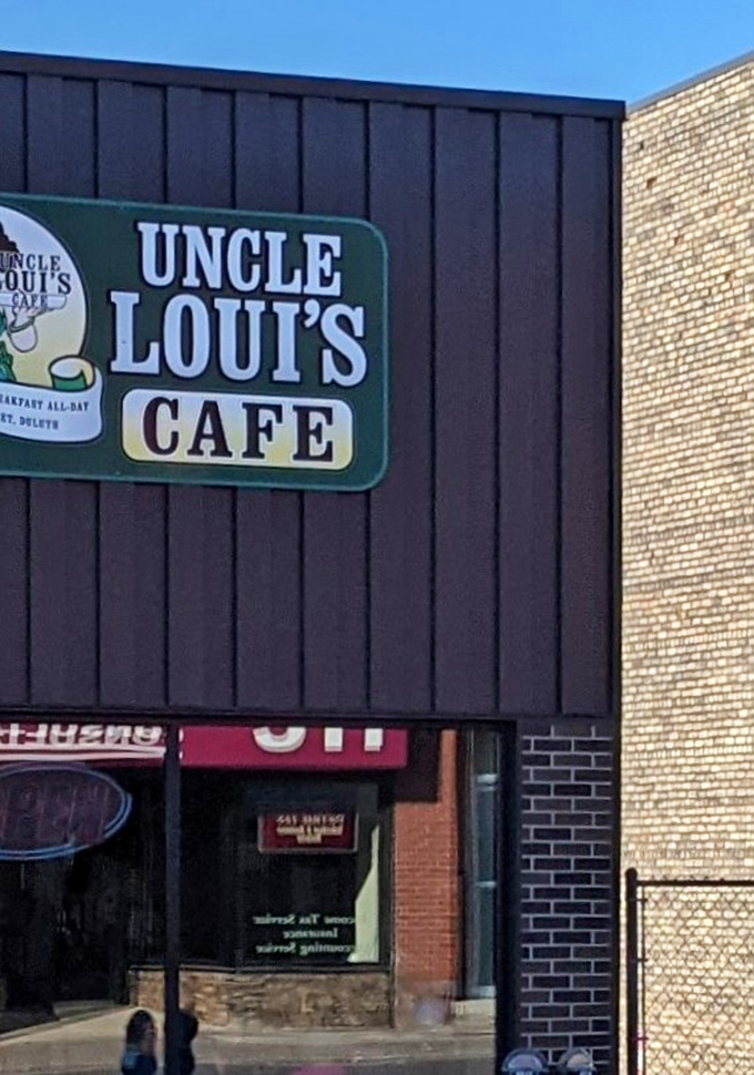 That iconic green sign against the dark exterior is like a beacon for breakfast lovers wandering the streets of Duluth with empty stomachs.