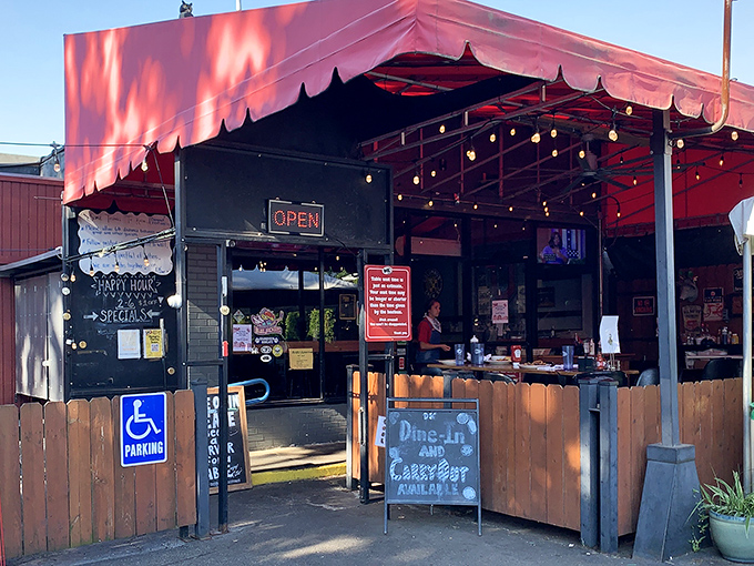The red awning beckons like a culinary lighthouse, promising comfort food treasures within this unassuming Grandview Heights gem.