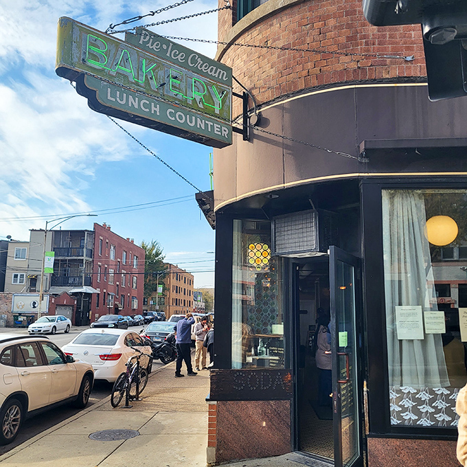 The vintage neon sign beckons like a time machine to simpler days, when dessert was a destination and calories didn't count on Sundays.
