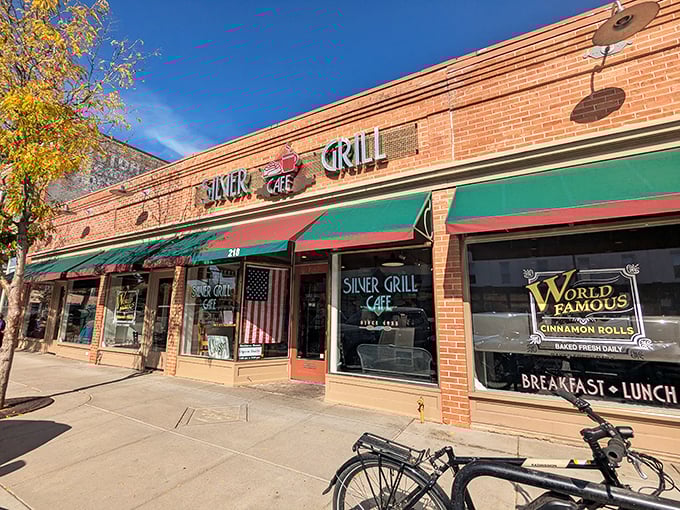 The brick facade of Silver Grill Cafe stands proudly in Fort Collins, announcing its presence with vintage charm and the promise of those famous cinnamon rolls.