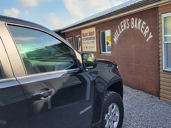 Where modern convenience meets Amish Country charm. The simple sign tells you everything you need to know: fresh baked goods await inside.