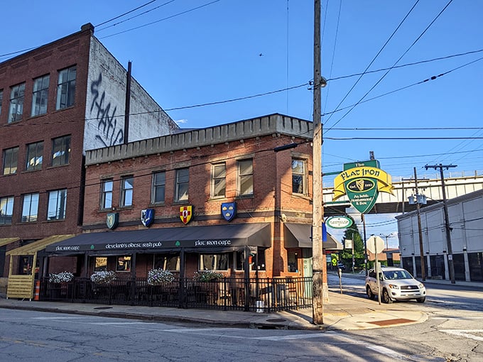 The triangular-shaped Flat Iron Cafe stands proudly at its corner, heraldic shields announcing its Irish heritage like medieval sentinels guarding a delicious treasure within.