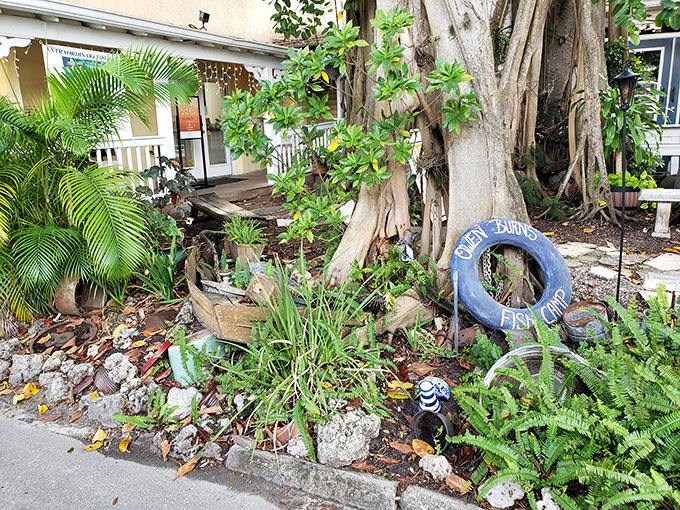 The entrance to Owen's Fish Camp feels like stumbling upon a secret garden, complete with that iconic blue tire swing that practically whispers "come on in."