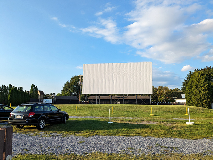 The iconic white screen stands sentinel against the Pennsylvania sky, a blank canvas awaiting twilight's transformation into movie magic.