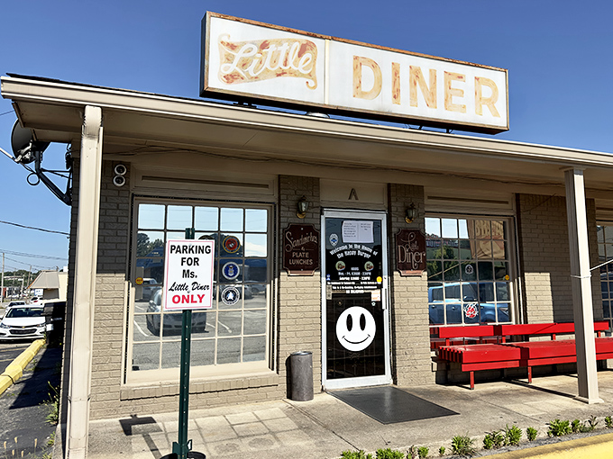 Red benches outside offer a spot to contemplate life's big questions, like "How soon can I come back for another burger?" while waiting for a table.
