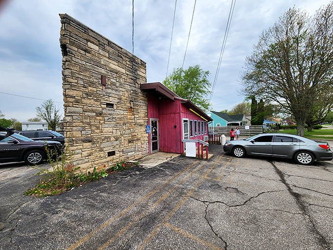 The unassuming pink exterior of Porky's Drive-In stands as a beacon of culinary authenticity in Mansfield, where legendary coney dogs await the hungry traveler.