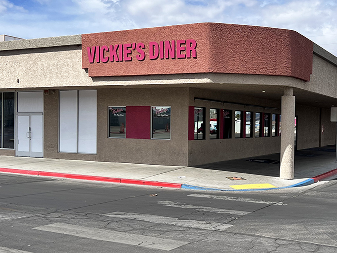 The pink-lettered promise of Vickie's Diner stands out against the Las Vegas sky, a retro beacon for hungry souls seeking refuge from slot machines and showgirls.