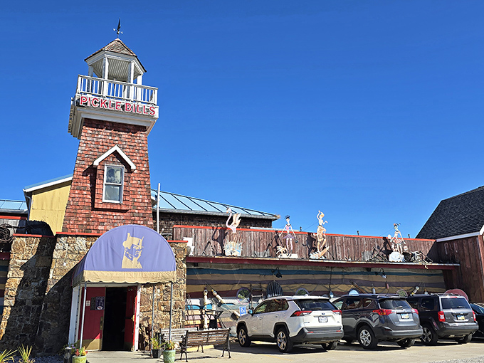 The lighthouse-inspired tower and stone facade of Pickle Bill's stands like a seafood beacon in landlocked Ohio, promising maritime delights under that unmistakable purple awning.