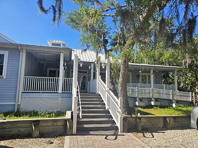 The stairway to seafood heaven. Aunt Kate's charming blue exterior welcomes you with Spanish moss and Florida sunshine.