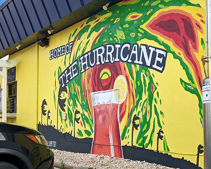 The sunshine-yellow exterior with its swirling hurricane mural isn't just a building—it's a mood-altering device disguised as a restaurant.