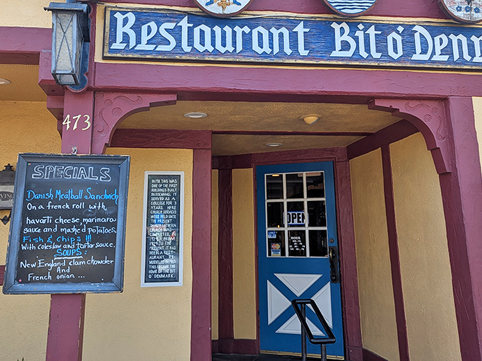 That blue door practically winks at you, promising Danish delights and maybe the best sandwich of your life.
