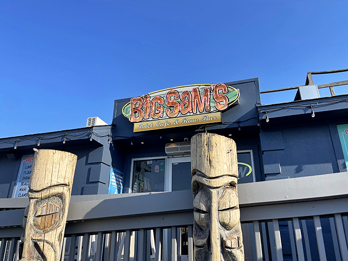 The iconic Big Sam's sign welcomes hungry visitors like a beacon of seafood salvation. Those tiki posts aren't just decorative&mdash;they're guardians of good taste.