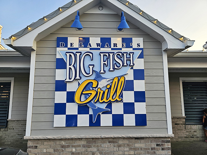 The iconic blue and white checkered sign welcomes hungry pilgrims like a lighthouse beacon for seafood lovers. Delaware's coastal treasure awaits!