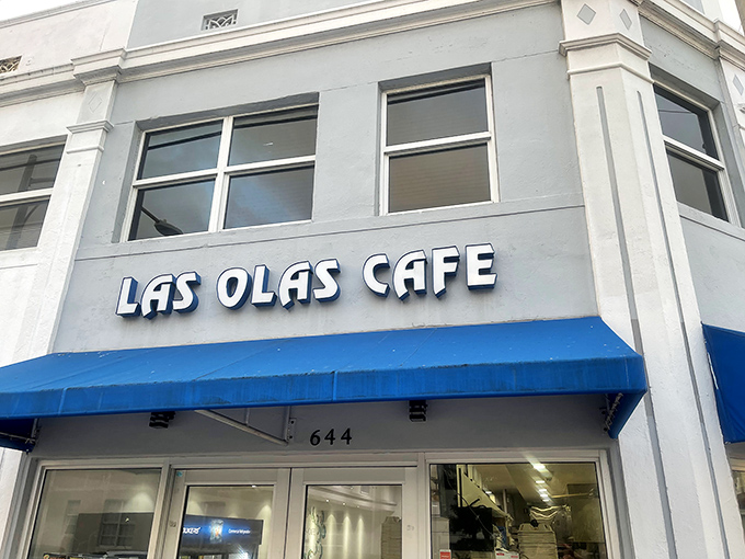 The iconic blue signage of Las Olas Cafe promises authentic Cuban delights within this unassuming South Beach gem.