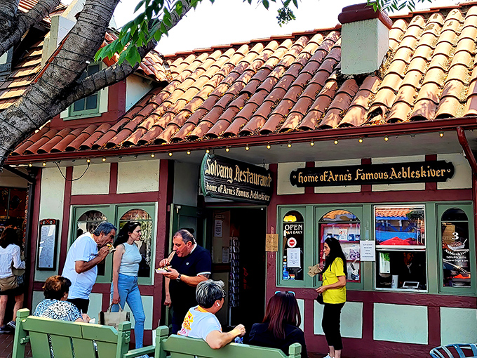 The Danish village facade that makes you question if your GPS accidentally teleported you to Copenhagen.