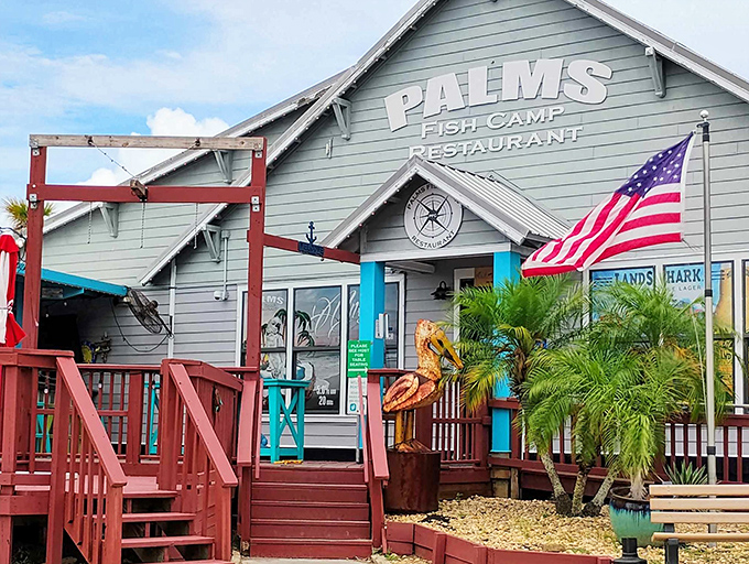 Old Florida charm greets you at the entrance, where weathered wood, palm trees, and a giant decorative crab set the stage for seafood bliss.