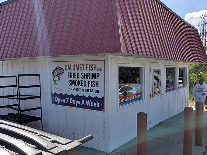 The iconic red-roofed shack at the edge of the Calumet River stands as a testament to Chicago's enduring love affair with perfectly smoked seafood.