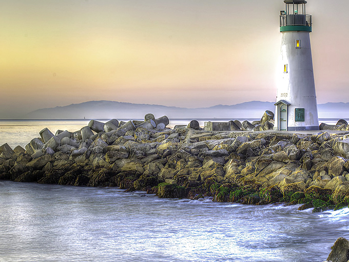 Sunset magic transforms Walton Lighthouse into a coastal dreamscape. Like California's version of a fairytale castle, but with better parking and saltier air.