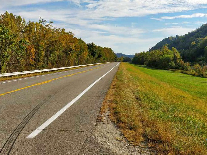 Sunset paints the Ohio River in impossible hues of amber and gold, turning an ordinary evening into nature's masterpiece.