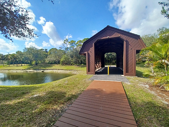 The bridge stands like a New England daydream against Florida's blue sky, its wooden pathway inviting you to cross into another world.