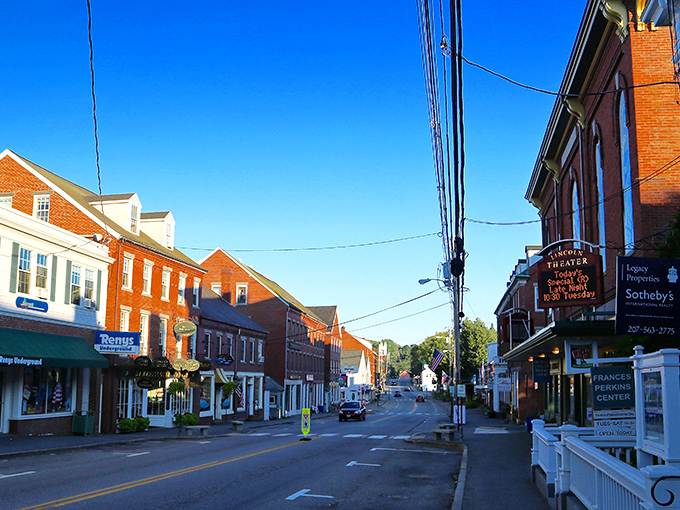 Main Street magic at its finest &ndash; Damariscotta's historic brick buildings stand like sentinels of small-town charm under that impossibly blue Maine sky.
