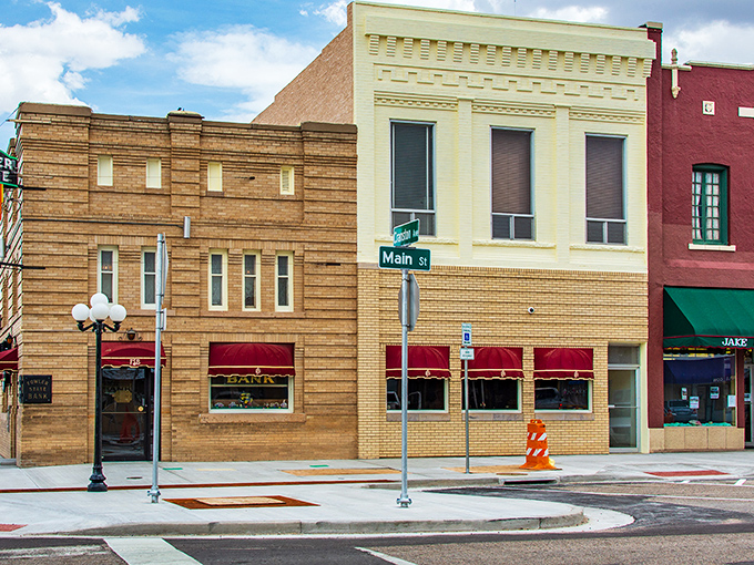Main Street in Fowler showcases classic small-town charm with its well-preserved brick buildings, vintage awnings, and unhurried atmosphere—a glimpse into simpler times.