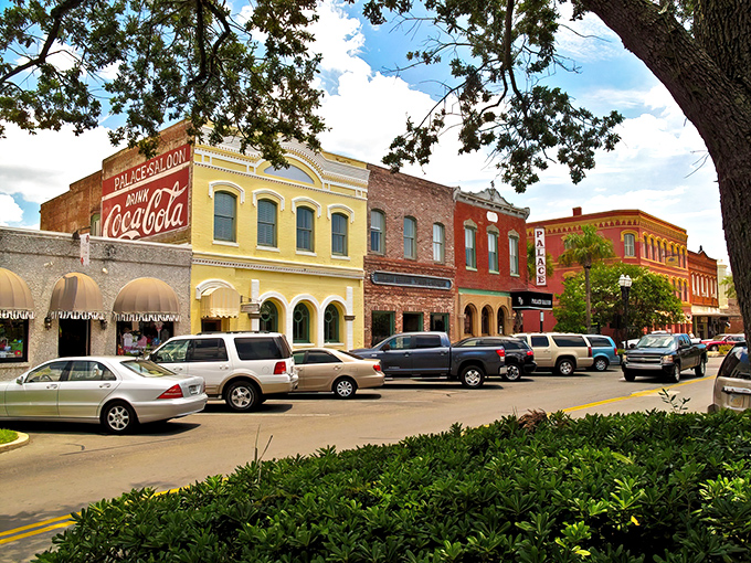 Brick buildings with teal awnings line the streets of Fernandina Beach, where Victorian architecture meets Florida sunshine in perfect harmony.