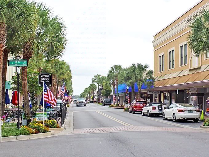 Main Street Leesburg offers that perfect blend of small-town charm and modern convenience, where American flags flutter alongside palm trees in a quintessentially Florida tableau.