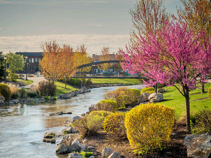 Indian Creek flows through downtown, flanked by vibrant spring blossoms that transform Caldwell into a postcard-perfect retirement paradise.