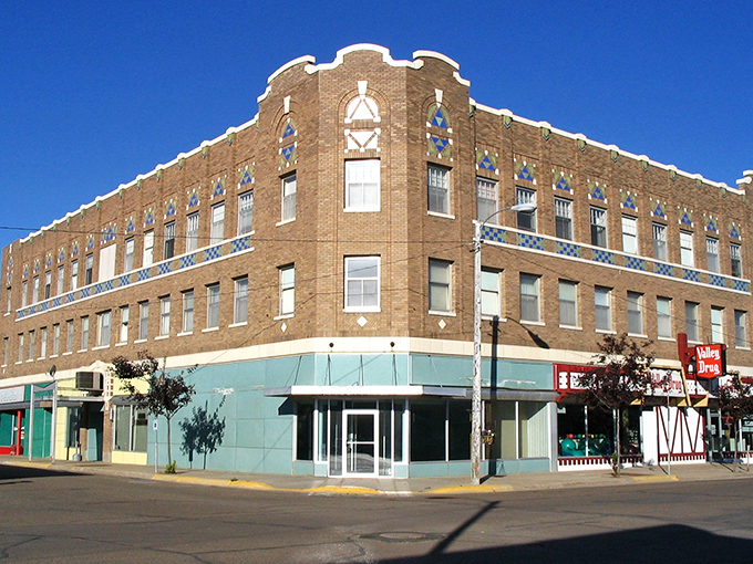 This historic brown building stands as Glasgow's architectural crown jewel, its ornate brickwork whispering stories from another era.