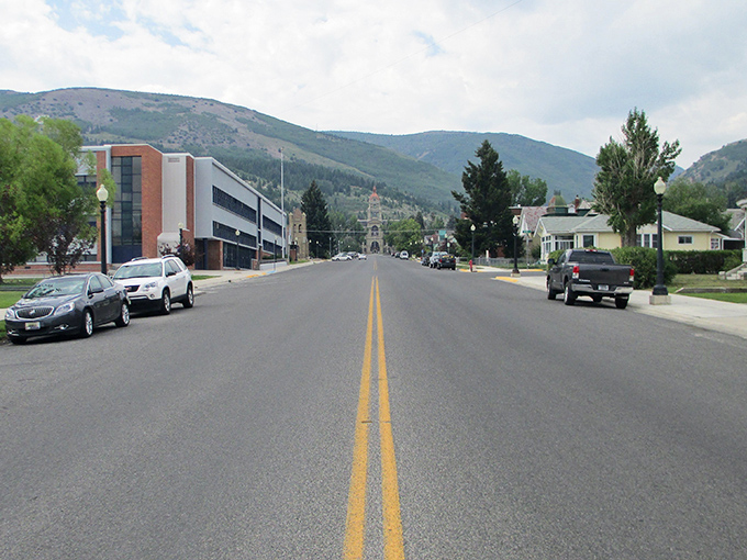 Main Street stretches toward mountain vistas, where the road ahead promises adventure and the mountains whisper, "Retirement doesn't mean slowing down."