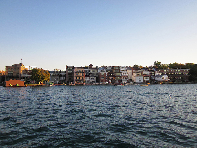 The waterfront view showcases colorful buildings reflecting in the crystal-clear lake&mdash;nature's mirror showing off the town's best angles.