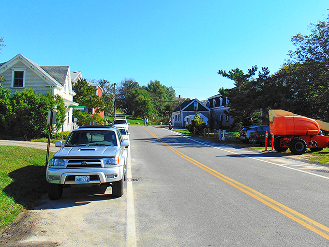 Quintessential New England charm on full display. This quiet street in New Shoreham whispers promises of afternoon strolls and neighborly waves across picket fences.