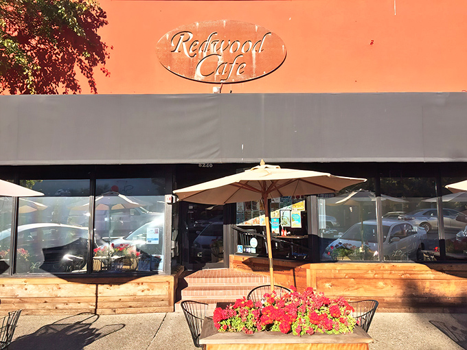 The iconic terracotta-orange exterior of Redwood Cafe stands out like a cheerful beacon, promising comfort food treasures within its unassuming walls.