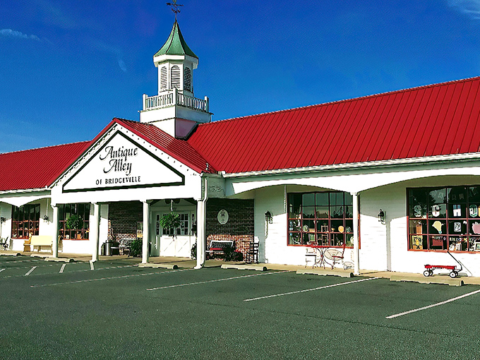The iconic red roof and charming cupola of Antique Alley stand out against the blue Delaware sky like a beacon calling all treasure hunters home.