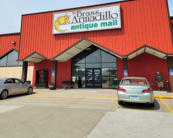 The bright red exterior of Brass Armadillo stands like a beacon of nostalgia, promising treasure hunters a paradise of possibilities within.