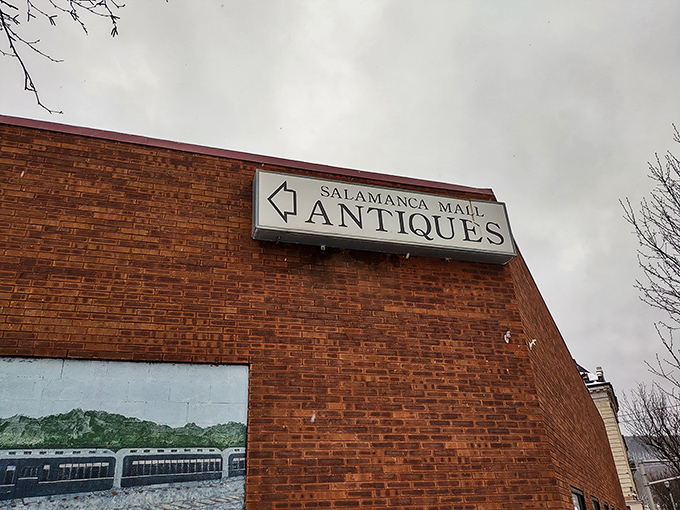 Another view of the exterior with its directional sign&mdash;like a humble roadside billboard pointing toward a time-traveling adventure rather than just a building.