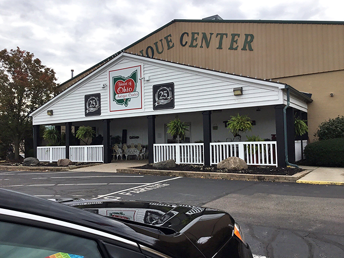 Blue skies frame this treasure hunter's paradise where even the landscaping hints at vintage charm. The white porch practically whispers, "Come on in, the past is waiting for you."