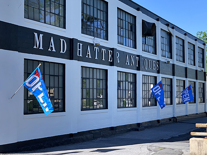 Blue "OPEN" flags flutter invitingly outside this vintage wonderland, beckoning treasure hunters to step into Pennsylvania's antique paradise.