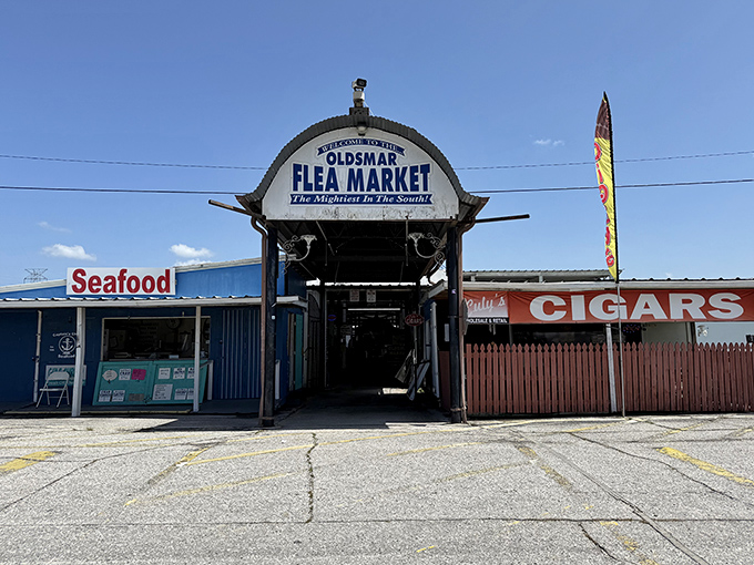 The iconic arched entrance to Oldsmar Flea Market stands like a portal to bargain paradise, flanked by seafood and cigars&mdash;Florida's version of "Open Sesame."