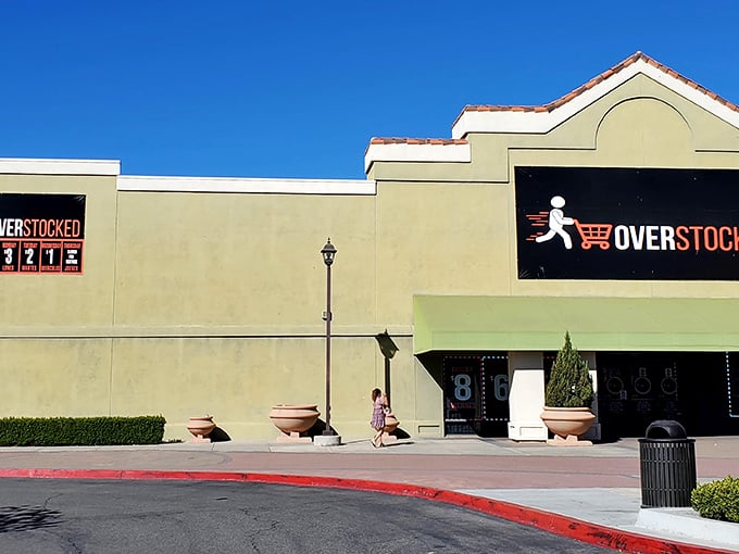 The unassuming exterior of Overstocked Bins belies the treasure trove within, like finding a Michelin-star restaurant in a strip mall.