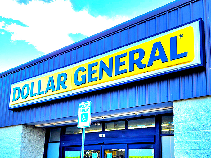 The iconic yellow and blue sign beckons like a retail lighthouse on Alabama's coast, promising treasures that extend far beyond typical dollar store expectations.