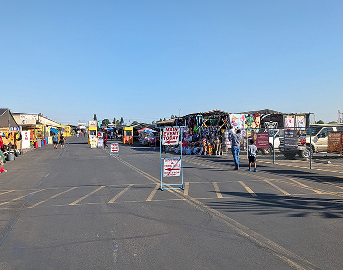 Rows of vendor stalls stretch into the distance, proving that retail therapy doesn't require air conditioning or mall pretzels.