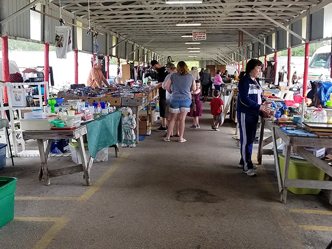 Weekend warriors and families explore the open-air section, where folding tables become stages for life's discarded supporting characters seeking second acts.
