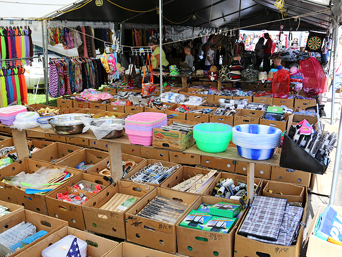 Treasure hunters paradise! Cardboard boxes overflow with potential finds while colorful household goods and clothing create a shopper's maze at Friendship.