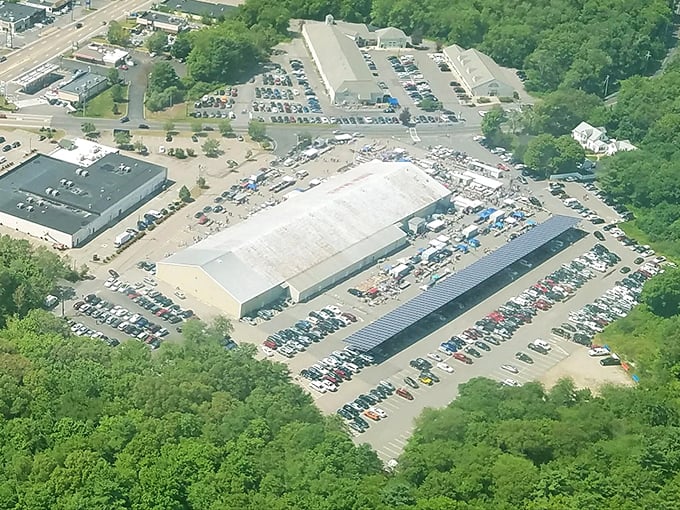 The aerial view doesn't lie—Raynham Flea Market sprawls like a treasure hunter's paradise, with packed parking lots surrounding massive buildings where bargains await.